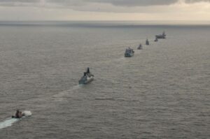 UK's warship trio protects world’s largest warship in Arctic exercise ...